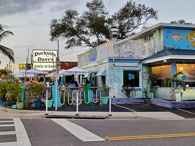 Welcome to Dockside Dave's, where the neon sign beckons like a lighthouse for hungry sailors. This little slice of seafood heaven is about to rock your taste buds!