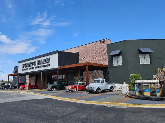 Welcome to spud paradise! The Potato Barn's exterior is a quirky blend of rustic charm and vintage Americana, complete with classic cars that'll make you say "Holy guacamole!" Photo credit: Lynne Stanforth