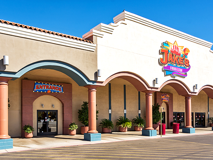 Welcome to Jake's Unlimited, where childhood dreams meet adult-sized fun! This vibrant entrance promises a world of excitement behind those doors. Photo credit: Timothy Bibb