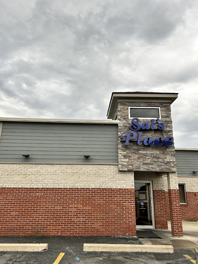 Under moody Michigan skies, Sal's Place stands proud with its modern stone-and-brick facade - a beacon of comfort food that beckons hungry travelers.