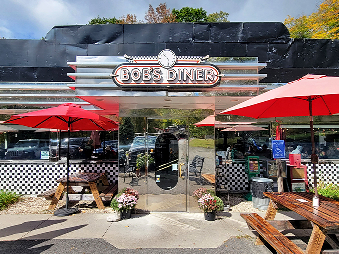 Welcome to Bob's Diner, where the chrome shines brighter than a 1950s Cadillac and the red umbrellas beckon like beacons of culinary delight.