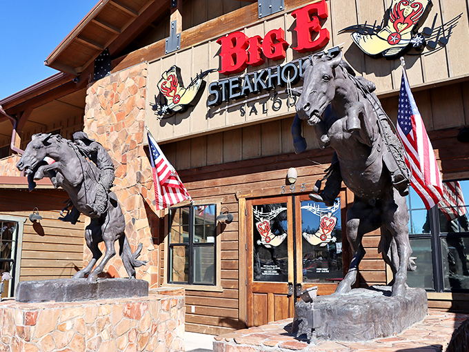 Howdy, partner! This ain't your average chuck wagon. Big E Steakhouse stands tall, with bronze cowboys guarding the gates to flavor town.