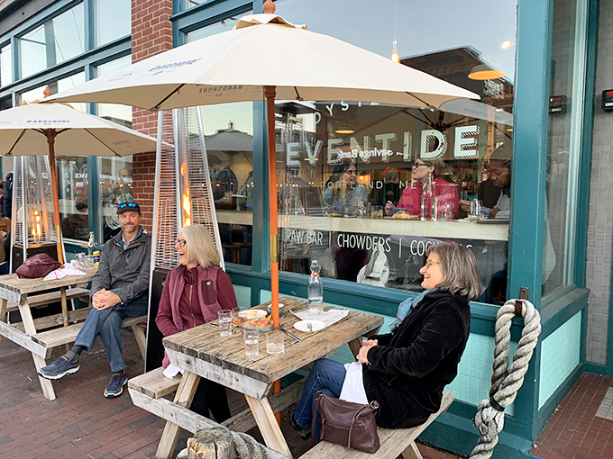 A seafood lover's dream come true! Eventide's turquoise exterior and cozy outdoor seating invite you to dive into a world of oceanic delights.