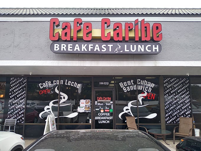 Welcome to flavor town! Cafe Caribe's storefront promises a Cuban culinary adventure that'll make your taste buds salsa with joy. Photo credit: Robert Negron