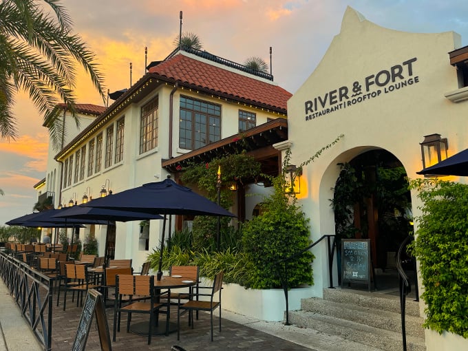 Sunset dreams come true! River & Fort's exterior beckons with Mediterranean charm, promising an evening of culinary delights and waterfront magic. Photo credit: Perry Knotts