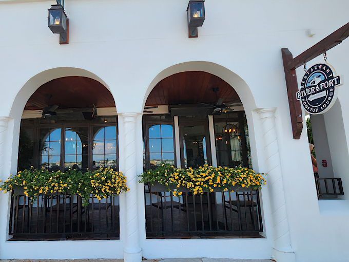Welcome to flavor paradise! River & Fort's charming exterior, with its sunny yellow flowers, promises a feast for both eyes and taste buds. Photo credit: L D