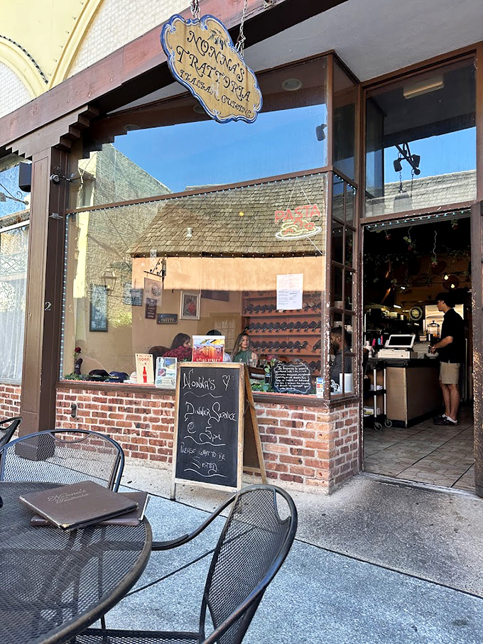 Welcome to Nonna's! Where the sign says "trattoria," but your taste buds will scream "paradise." This charming storefront promises a culinary journey that'll make you forget you're in Florida. Photo credit: Louis and Elaine