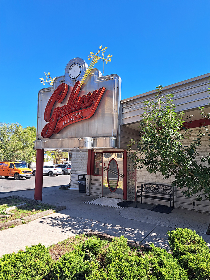 Beam me up, Scotty! This retro-futuristic sign is your portal to a world where malts flow like stardust and burgers defy gravity.