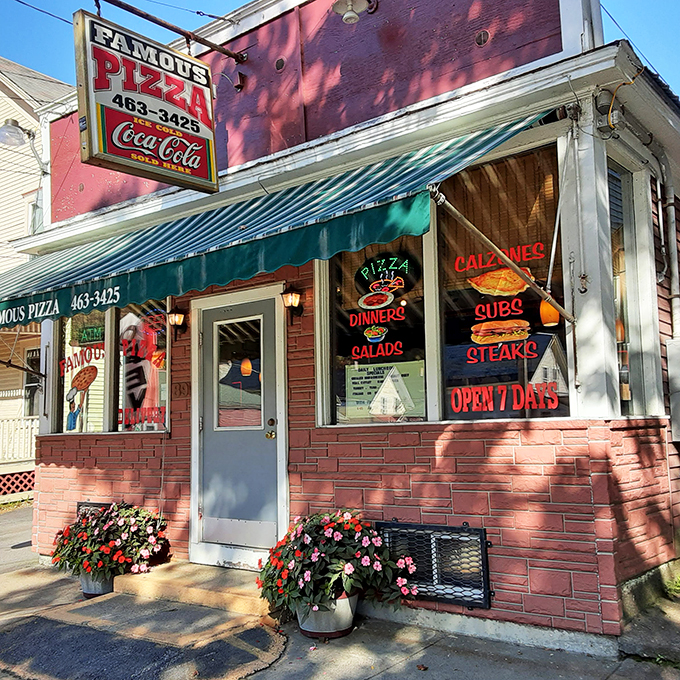 A slice of Americana! This charming brick facade with its jaunty green awning promises comfort food that'll make you feel right at home.