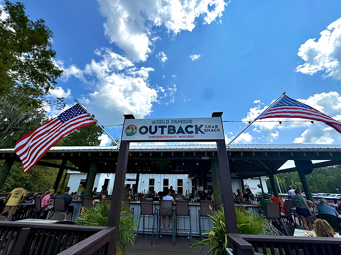 Welcome to flavor town! The Outback Crab Shack's entrance is like a portal to seafood paradise, complete with star-spangled banners.