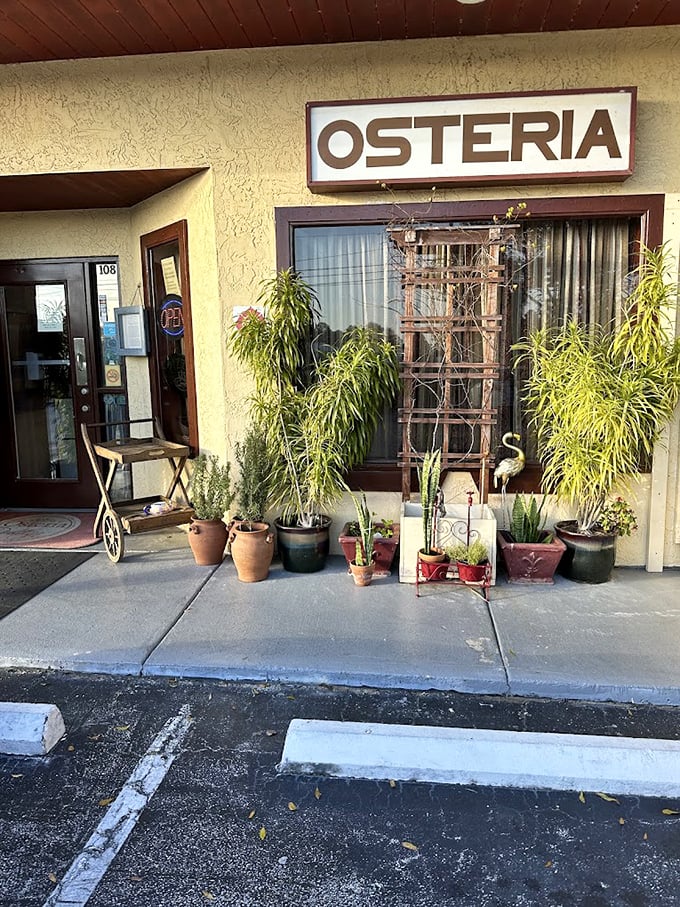 Welcome to Osteria Rustica, where Florida meets Italy! This charming fa&ccedil;ade is like a portal to Tuscany, complete with potted plants that seem to whisper, "Mangia!"
