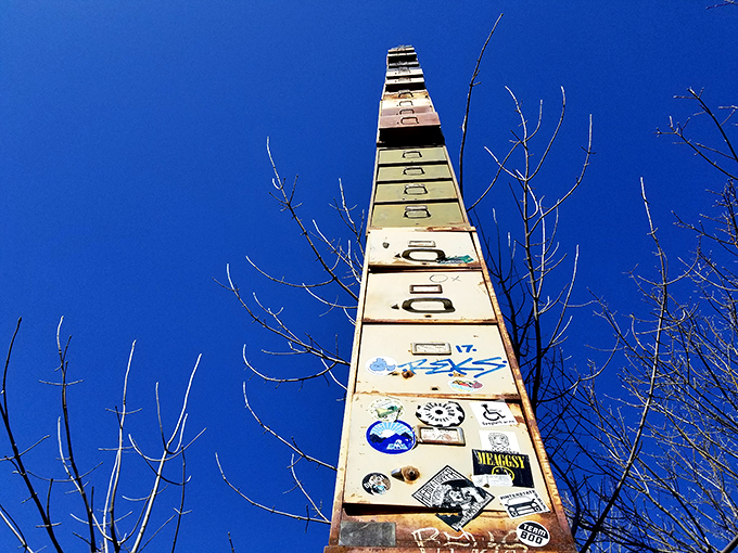 Reaching for the sky, this towering tribute to office supplies stands tall against the azure backdrop. It's like the Empire State Building's quirky cousin decided to visit Vermont!