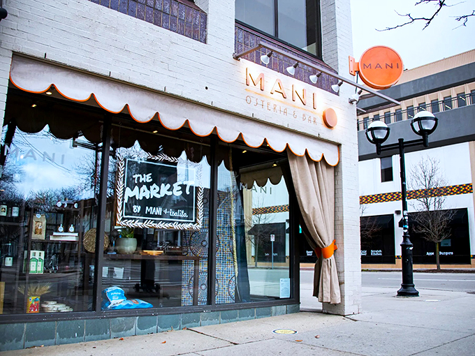 Welcome to Mani Osteria, where the awning waves hello and the aroma of pizza beckons you inside. It's like the Wonka Factory for grown-ups who prefer parmesan to chocolate.