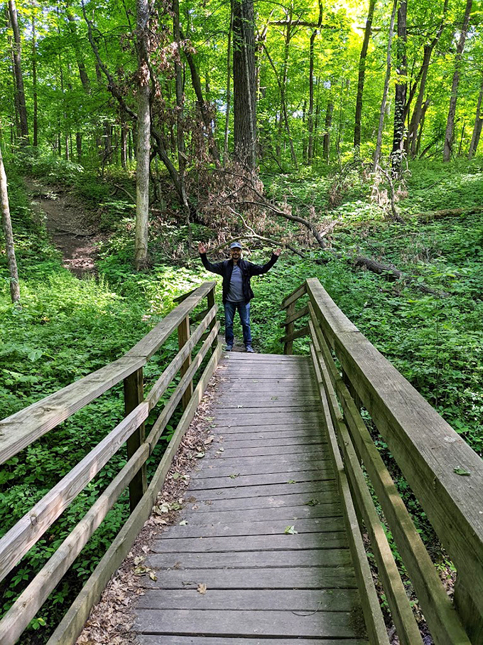 "Arms up if you're having fun!" This enthusiastic hiker embodies the joy of conquering nature &ndash; or at least a moderately challenging set of stairs.