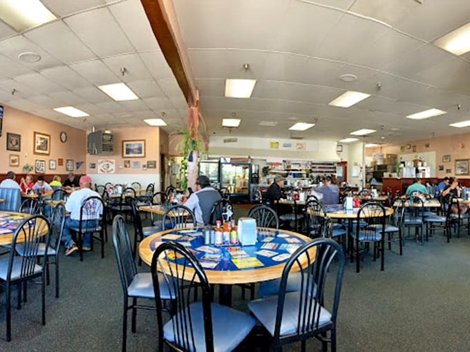 A sea of tables ready for the morning rush, where every chair has hosted countless conversations over countless cups of coffee.