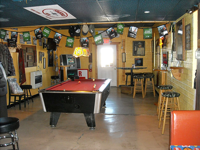 A pool table surrounded by memorabilia offers entertainment between bites, keeping the classic roadhouse spirit alive.
