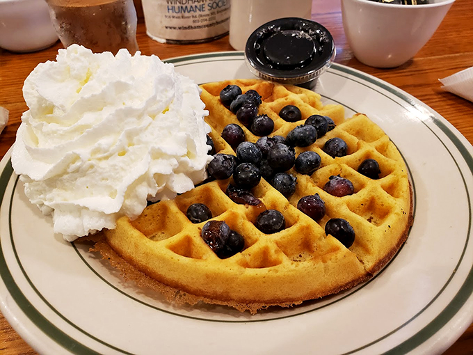 This isn't just a waffle; it's a work of art. Van Gogh had his 'Starry Night,' Dot's has its 'Blueberry Morning.' Both are masterpieces, but only one is deliciously edible.