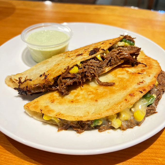 Quesadillas that'll make you say "holy guacamole!" These braised beef beauties are a cheesy, meaty fiesta for your taste buds.