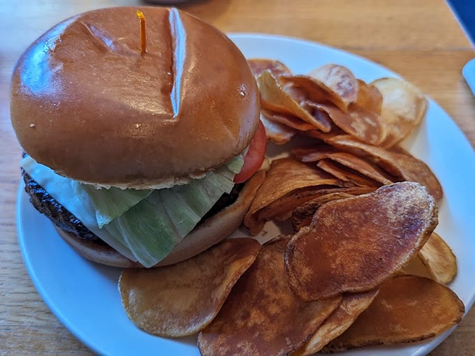 A classic burger with house-made chips that crunch louder than a Patriots touchdown celebration. Photo credit: Aaron N