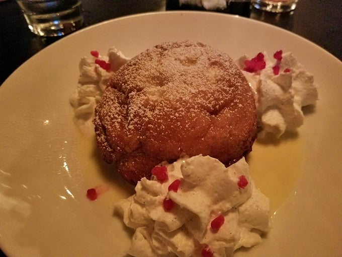 Dessert or work of art? This powdered sugar-dusted delight is surrounded by dollops of cream that look like fluffy clouds in a sweet sky. Photo credit: Steve R.