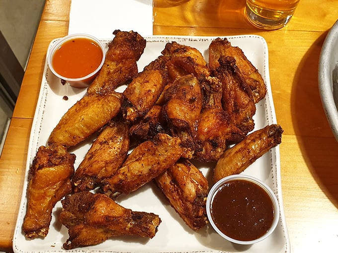 Crispy wings take flight with two dipping sauces, proving that even simple comfort food can soar to new heights. Photo credit: Maeddn11