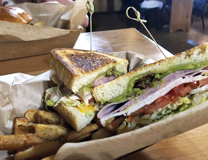 The club sandwich that'll have you singing "Hallelujah"! It's stacked higher than a cowboy's tales after a long night at the saloon.