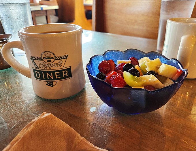 A perfect pair: Chelsea Royal's signature mug and a fruit salad so fresh, it's like summer decided to throw a party in a bowl.