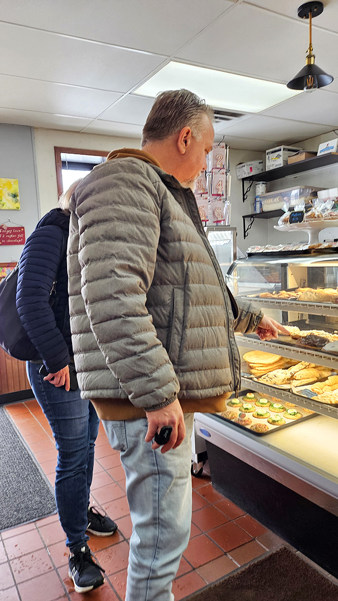 Decisions, decisions! Watching customers choose their treats is like observing kids in a candy store &ndash; pure, joyful indecision.
