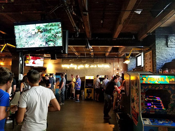 Gamers in their natural habitat. Notice the intense concentration, the camaraderie, the silent prayer to the joystick gods. Ah, nostalgia!