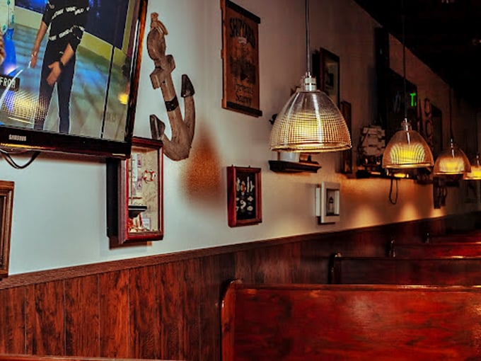 Nautical touches and warm wood paneling transport you to a cozy New England fish house.