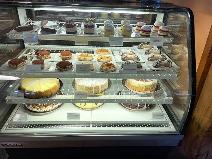 A glass case of sweet temptations where Italian classics meet Maine hospitality, each slice promising a perfect ending.