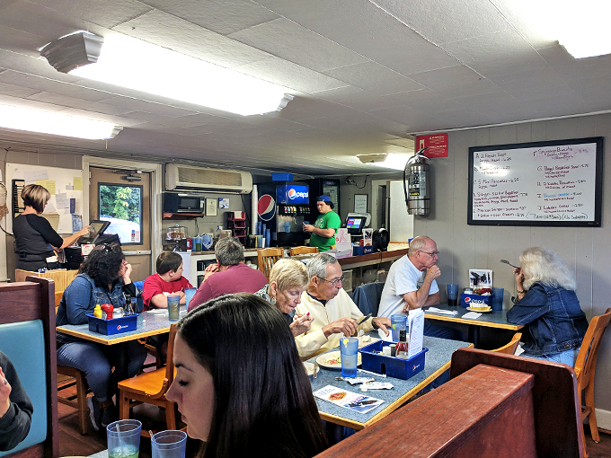 Where everybody knows your name… or at least your favorite seafood order! The bustling dining room is a testament to Eagle's Nest's local charm.