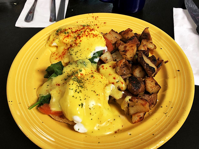 Hollandaise sauce cascading over poached eggs like a golden waterfall - breakfast doesn't get more beautiful than this.