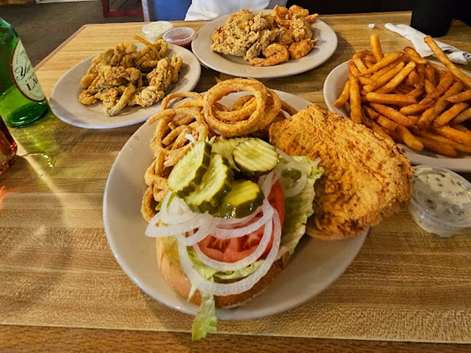 A feast fit for a coastal king: crispy onion rings, golden fries, and fresh seafood that will make your taste buds dance.
