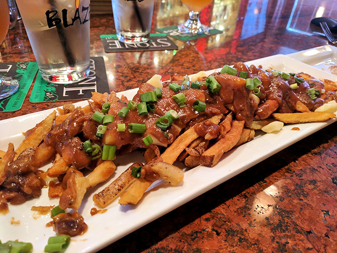 Poutine gets a gourmet makeover with rich gravy and green onions. These fries mean serious business.
