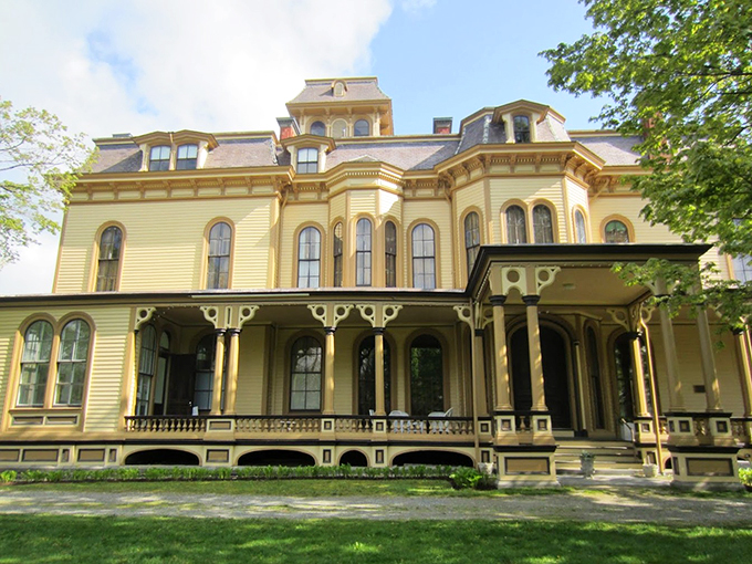 The mansion's butter-yellow exterior and elegant columns prove that sometimes, showing off is simply good architecture.