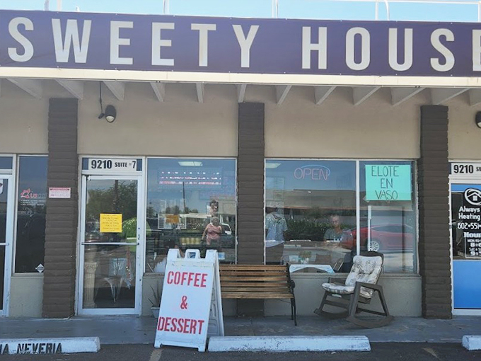 The storefront's simple signage and welcoming bench invite passersby to pause and indulge in something sweet.