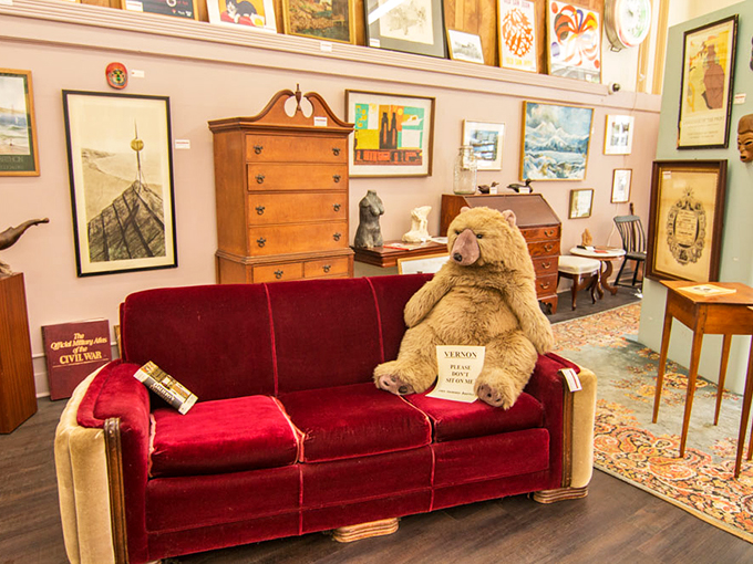 That plush red velvet couch with its bear companion might be the most Maine-themed seating arrangement ever.
