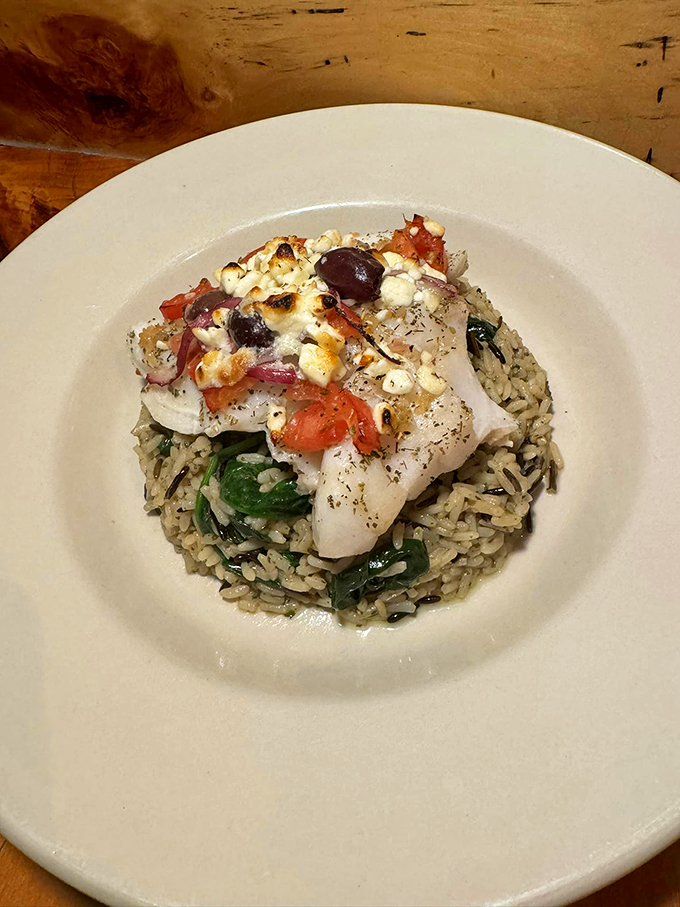Greek mythology meets New England seafood in this Grecian cod. Topped with a medley of Mediterranean flavors, it's a dish fit for the gods. Photo credit: Casey's Caboose