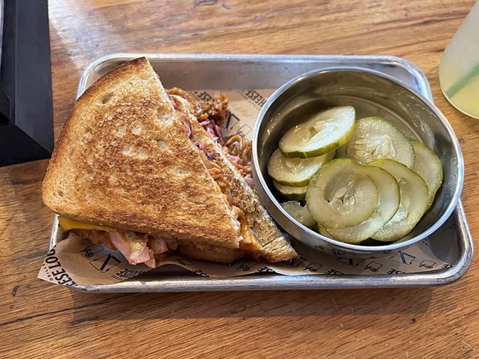 Every bite promises the perfect balance of crunch and melt, with house-made pickles standing guard. Photo credit: Gabriella S.