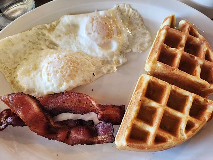Eggs, bacon, and waffles - the holy trinity of breakfast. This plate is so classic, it should be in a museum.