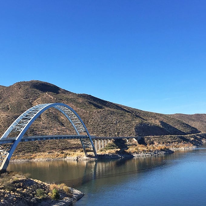 Nature's rollercoaster: Roosevelt Lake Bridge. It's like the Grand Canyon decided to take a dip and invited some engineering marvels along. Photo credit: LEE M