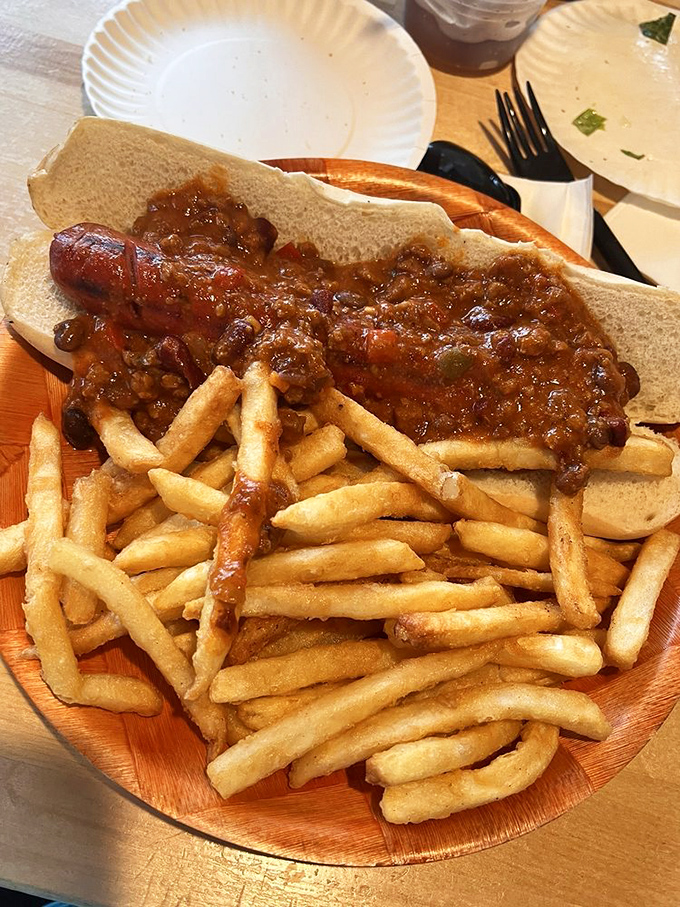 Chili so hearty it could win a personality contest, smothering a hot dog that never stood a chance against your appetite.