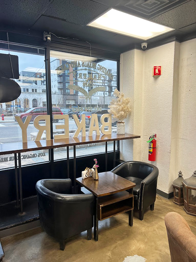 Leather club chairs and a fireplace create the kind of cozy corner where "just five minutes" turns into a delightful afternoon.