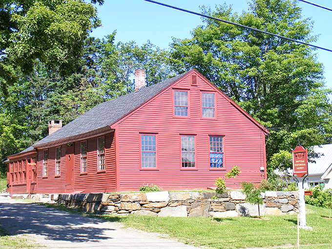 The Danville Historical Society building stands proud in its classic New England red, a guardian of local stories and memories. 
