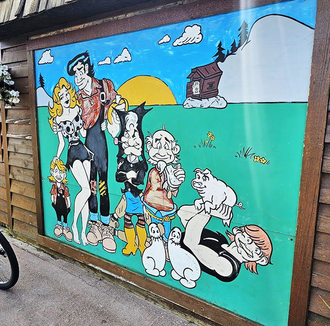 A colorful mural brings Li'l Abner's world to life, adding that perfect touch of nostalgia to your dining experience.