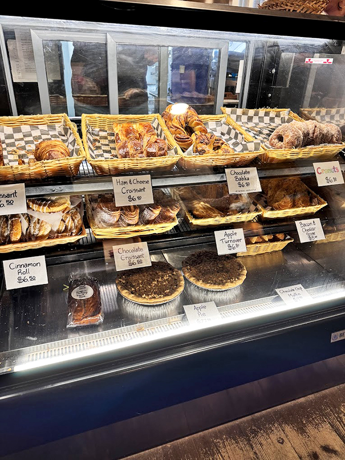 Display case full of pastries that look like they just graduated from a French culinary school with honors.