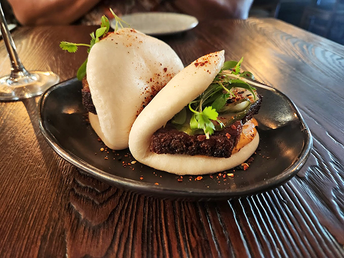 These steam buns look so pillowy soft, they could double as clouds in food heaven. The filling peeks out temptingly.