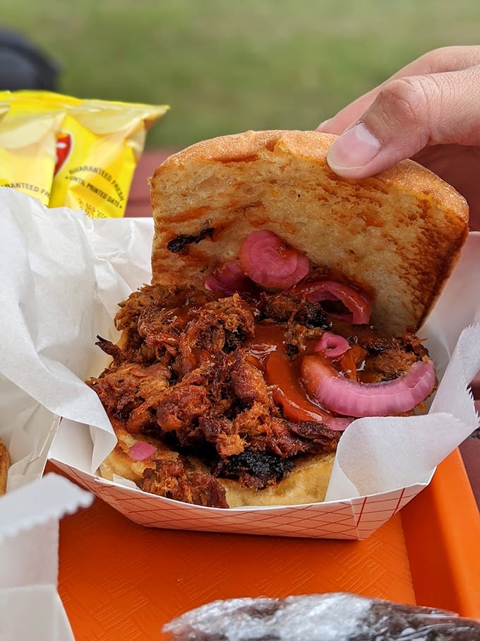 Pulled pork perfection: Tender meat meets maple chipotle BBQ sauce, with pickled onions adding that perfect zing. Photo credit: Raymond Gan