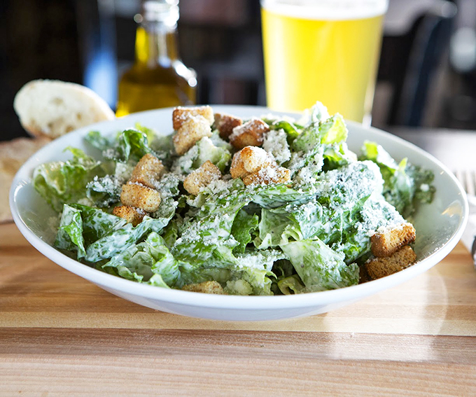 Even the Caesar salad gets dressed up for dinner, with crisp romaine and a shower of fresh Parmesan.